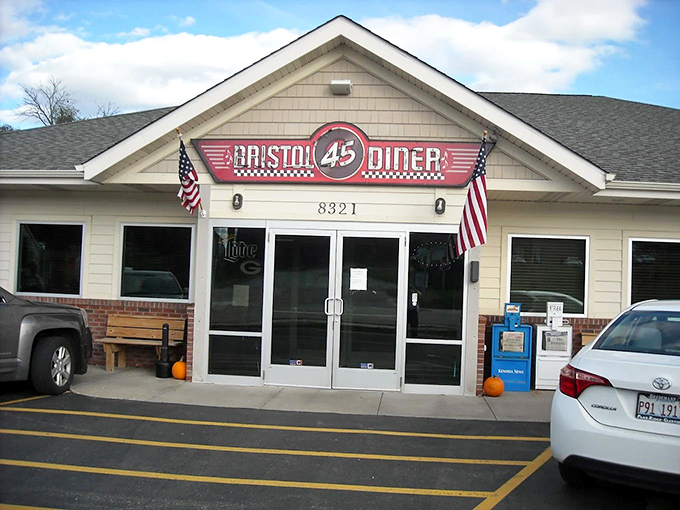 The Bristol 45 Diner's exterior promises a time-travel experience with its classic signage and American flags. Wisconsin's answer to nostalgic dining beckons from Highway 45.