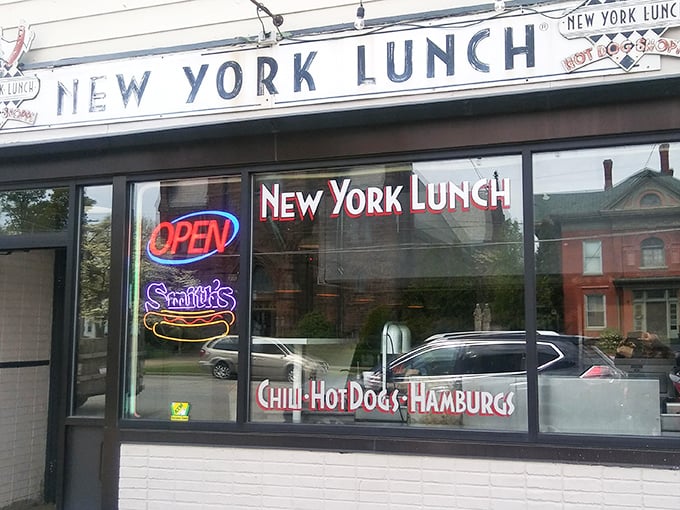 The unassuming storefront of New York Lunch belies the culinary treasures within. That neon "OPEN" sign might as well say "Food Paradise Ahead."