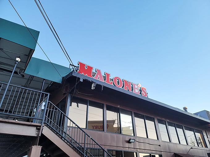 The unassuming exterior of Malone's Bar & Grill proves once again that the best seafood often hides behind the most modest facades.