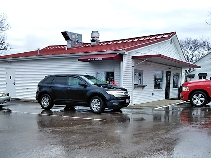The unassuming white clapboard building with its cheerful red roof stands like a time capsule of Americana, promising sweet relief from Ohio summers.