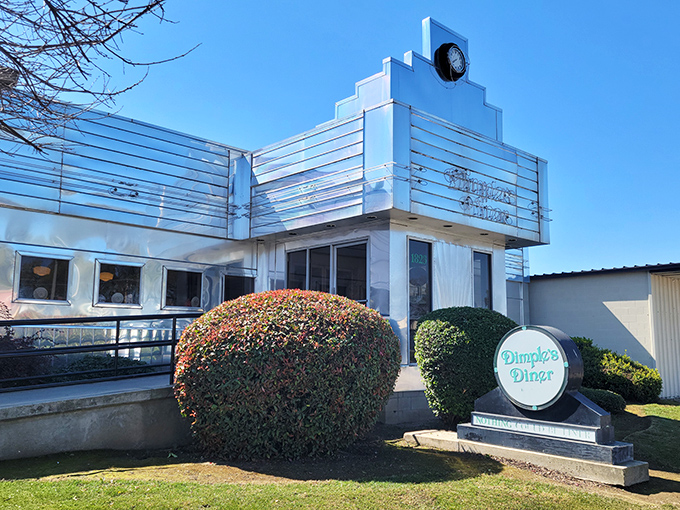 The gleaming Art Deco exterior of Dimples Diner stands like a chrome-plated time machine, promising breakfast dreams come true inside.
