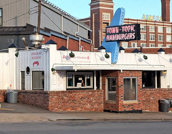 The iconic white brick building with its vintage signage stands as a time capsule of American diner culture, beckoning hungry travelers 24 hours a day.