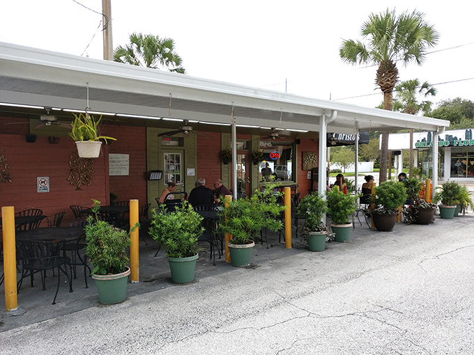 The coral-colored exterior of Christo's Caf&eacute; welcomes you with potted plants and outdoor seating&mdash;proof that culinary treasures often hide in unassuming packages.