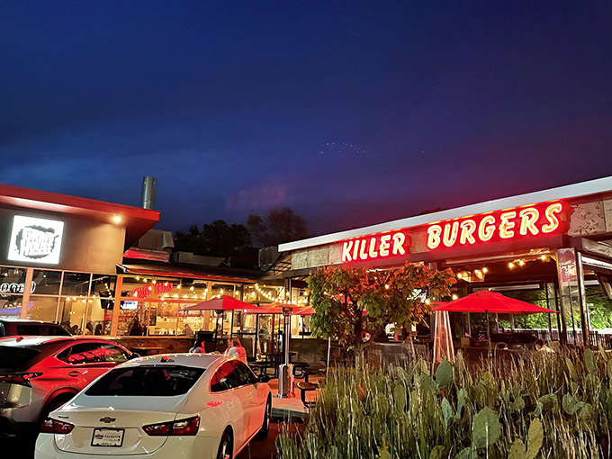 The converted gas station exterior screams "cult classic" with its bold red "KILLER BURGERS" sign – like a neon promise of delicious things to come.