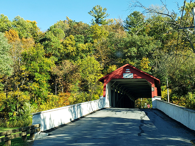 Standing proud since 1841, the Wehr Covered Bridge flaunts its crimson coat against Pennsylvania's blue skies like it's auditioning for a Norman Rockwell painting. 