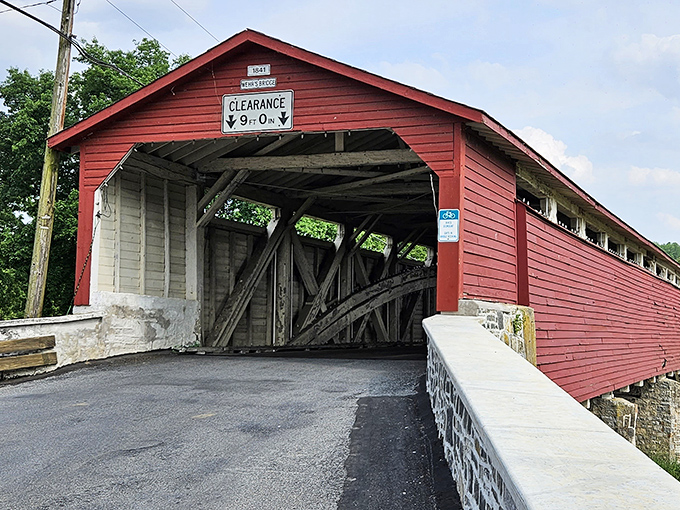 That classic red barn siding and stone foundation combo hits different when it's protecting history instead of hay.
