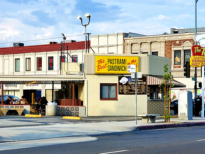 The iconic yellow sign promises "The Best Pastrami Sandwich in the World" &ndash; a bold claim The Hat has been backing up for decades.