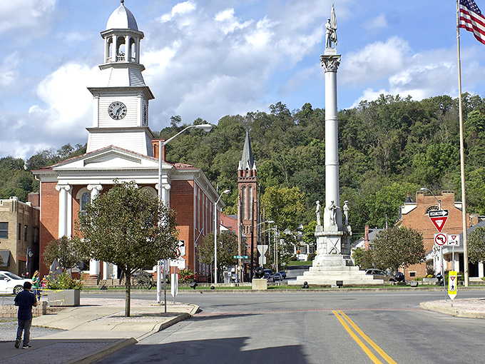 Lewistown's historic downtown square showcases classic Americana with its stately courthouse, towering monument, and church spires framed by rolling Appalachian foothills.