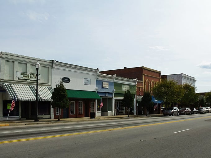 Broad Street beckons with its classic small-town charm, where that iconic clock tower stands like Camden's own personal timekeeper against a perfect Carolina blue sky.