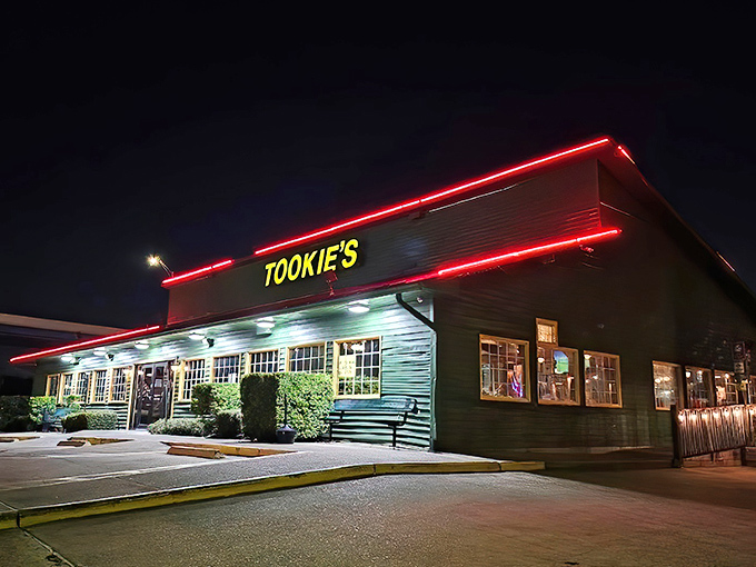 Tookie's neon sign glows like a lighthouse for hungry travelers, beckoning with the promise of comfort food that transcends the ordinary roadside experience.