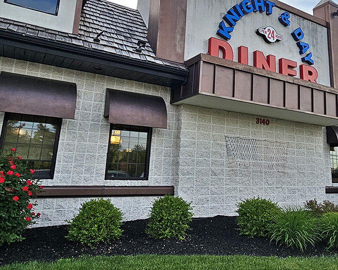 The iconic blue Knight & Day Diner sign promises comfort and satisfaction, standing like a beacon for hungry travelers on Pennsylvania's backroads.