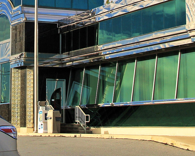 The Starlite Diner's exterior gleams like a mid-century time capsule, welcoming hungry travelers with its distinctive retro architecture and promise of comfort food classics.