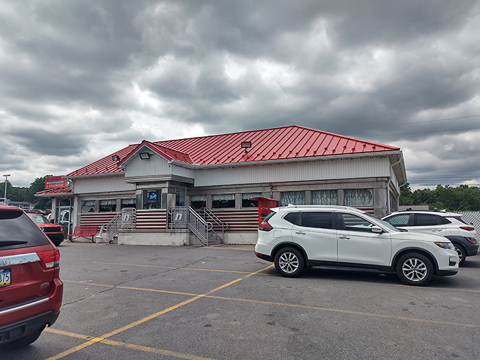 The iconic red roof of D's Diner stands out against Pennsylvania skies like a beacon calling hungry travelers home.