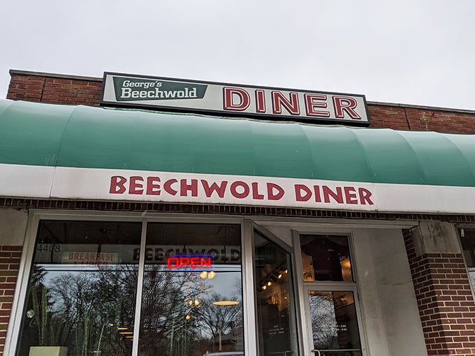 The classic green awning and bold red lettering of George's Beechwold Diner stands as a beacon of breakfast hope in Columbus, promising comfort food salvation to hungry souls.