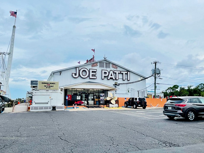The iconic white building with "JOE PATTI" boldly emblazoned across the top stands like a beacon for seafood lovers along Pensacola Bay.