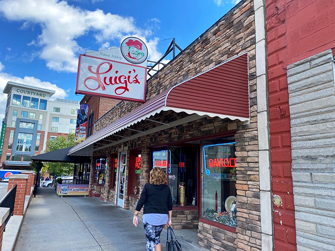 The iconic red and white sign beckons like an old friend. Luigi's has been holding court on this Akron corner since before many of us had our first pizza epiphany.