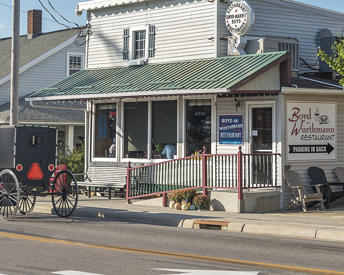 The classic white clapboard exterior with its signature green roof stands as a time capsule of Americana. Horse and buggy parking available!