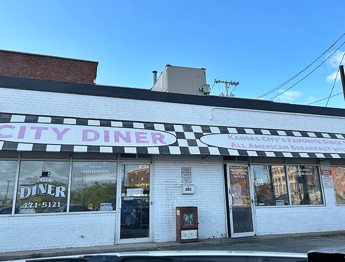 The classic black and white checkerboard awning of City Diner isn't just decoration&mdash;it's a beacon calling hungry souls to breakfast paradise in Kansas City.
