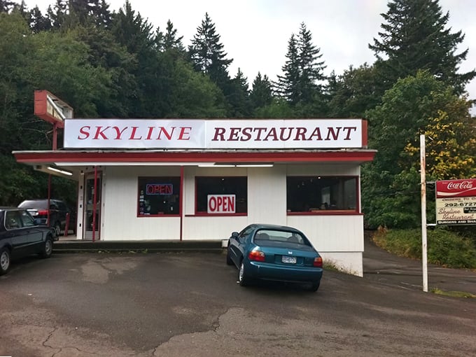 Nestled among towering evergreens, Skyline Restaurant's classic white-and-red exterior promises comfort food nirvana that time forgot&mdash;in the best possible way.