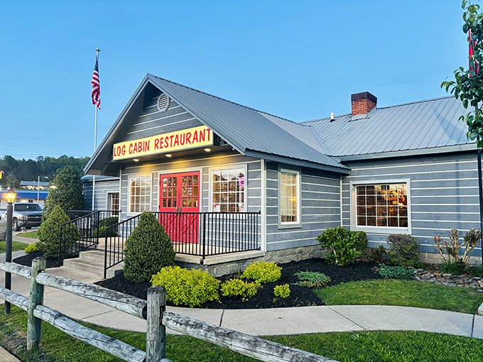 The iconic blue exterior with those cherry-red doors isn't just inviting—it's practically Tennessee's way of saying "get in here and eat something amazing."