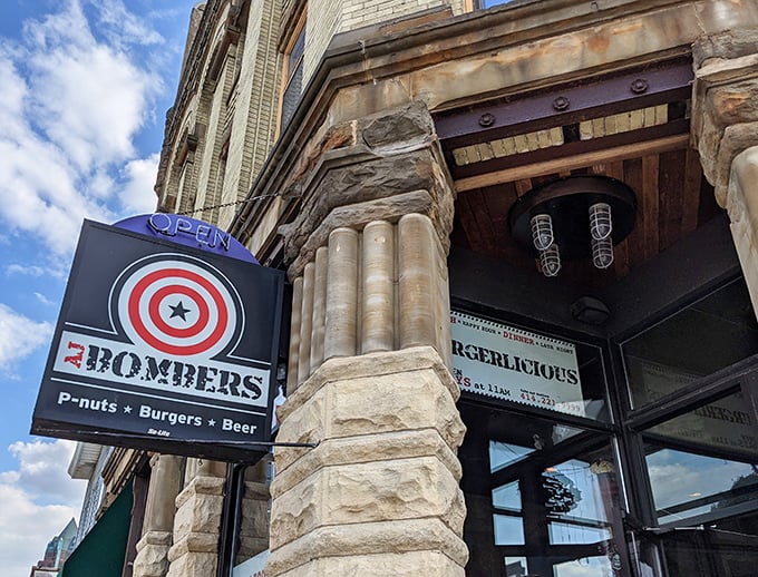 The historic facade of AJ Bombers stands as Milwaukee's answer to the age-old question: "Where can I find peanuts, burgers, and beer in one perfect trifecta?"
