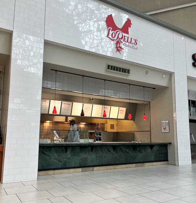 The iconic red chicken logo of LoRell's beckons from its clean, minimalist storefront&mdash;proof that greatness doesn't need flashy advertising.