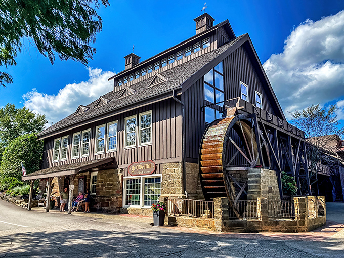 The historic Ye Olde Mill stands proudly against an Ohio blue sky, its wooden water wheel promising sweet memories and even sweeter treats inside.