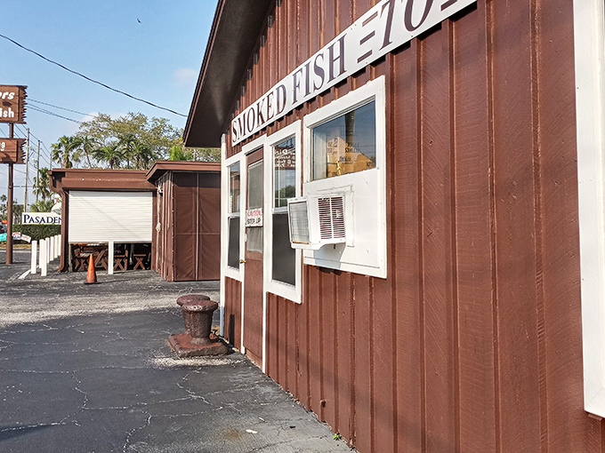 The unassuming exterior of Ted Peters beckons with promises of smoky treasures within. No fancy frills, just Florida fish-shack perfection waiting to happen.