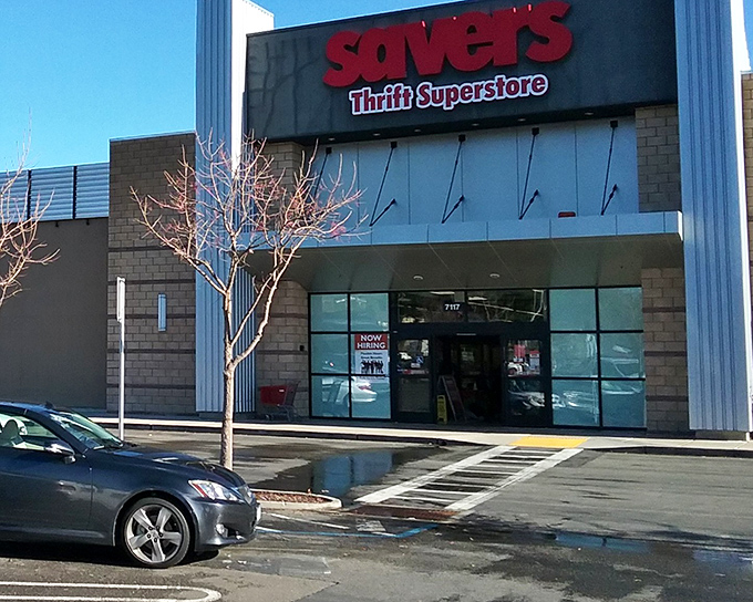 The red Savers sign stands out like a beacon of bargain-hunting hope. This unassuming exterior houses a universe of second chances and unexpected treasures.