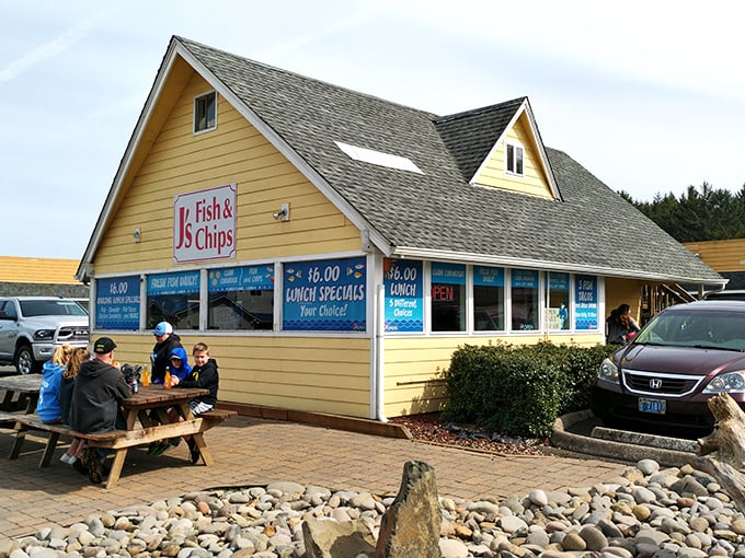 The bright yellow beacon of J's Fish & Chips stands out against the Oregon sky, promising seafood salvation to hungry coastal travelers.