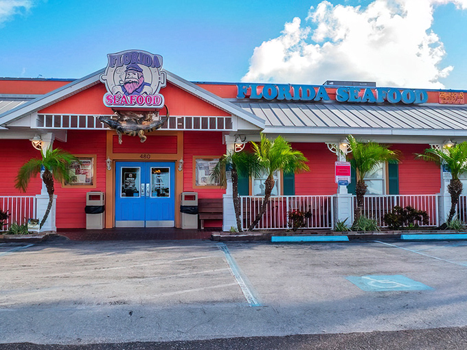 The coral-colored beacon of Florida's Seafood Bar & Grill stands out against the Cocoa Beach sky, promising seafood treasures that locals have been quietly hoarding for themselves.