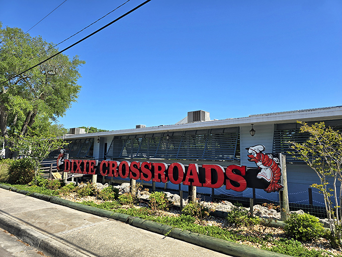 The iconic red signage of Dixie Crossroads stands as a beacon for seafood lovers, promising treasures from the deep that have made this Titusville landmark famous.