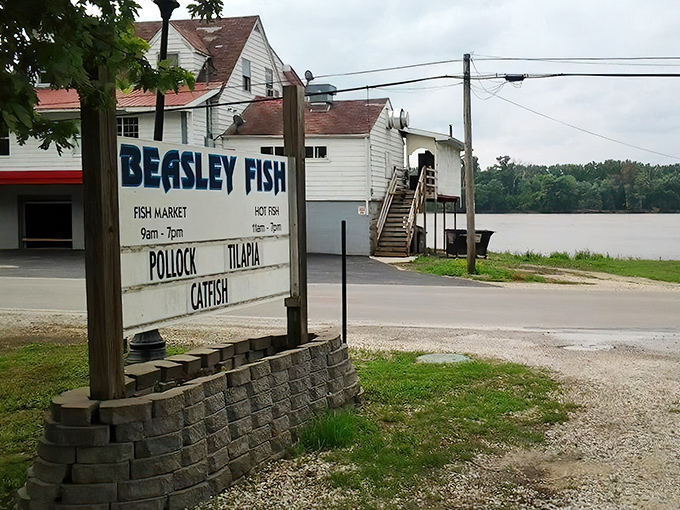 The unassuming white clapboard building with its bold blue signage promises one thing: authentic river cuisine without pretense. Mississippi views included at no extra charge.