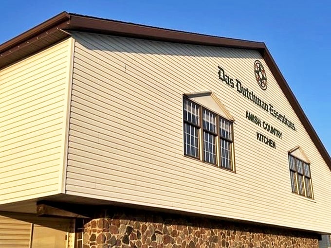 The iconic yellow exterior of Das Dutchman Essenhaus stands like a beacon of comfort food in Middlebury, promising Amish cooking that'll make your cardiologist weep and your soul sing.