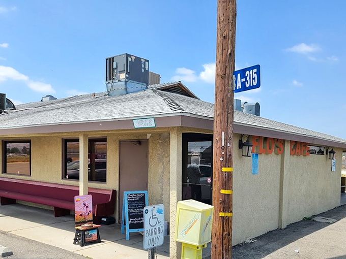 The unassuming exterior of Flo's Airport Cafe stands like a time capsule at Chino Airport, promising comfort food that's been fueling pilots and locals for generations.