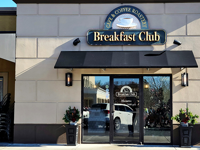 The Breakfast Club's welcoming fa&ccedil;ade stands like a beacon for morning food pilgrims, with its classic black awning promising comfort inside.