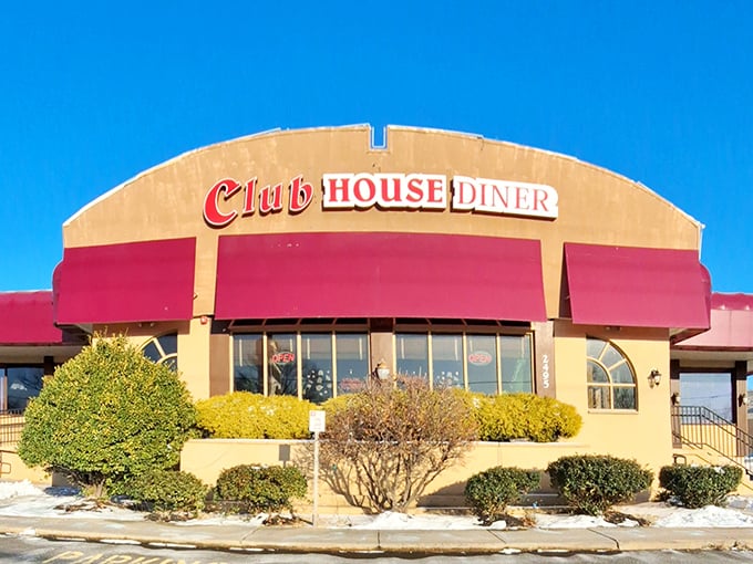 The Club House Diner's iconic red awnings and cream exterior stand as a beacon of comfort food promise in Bensalem. Like finding an old friend in a sea of chain restaurants.