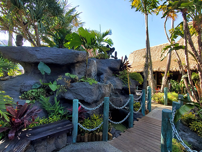Wooden pathways wind through lush tropical gardens, creating the perfect entrance to this Polynesian paradise. Who needs a plane ticket to Bora Bora?