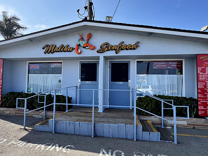 The unassuming white facade of Malibu Seafood, where that iconic red lobster sign has been beckoning seafood lovers off PCH for decades.