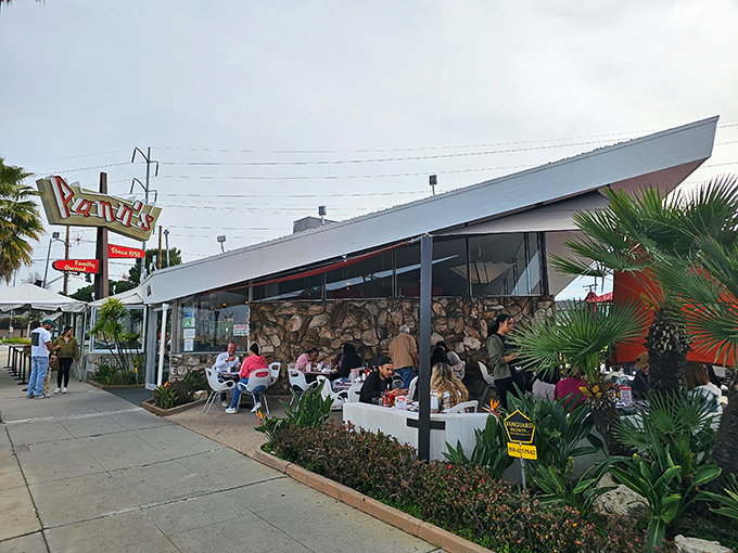 The iconic angular roof of Pann's slices through the LA sky like a mid-century dream. Classic Googie architecture at its finest, complete with that unmistakable neon sign.
