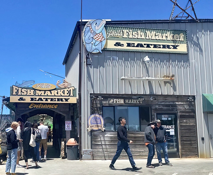 The unassuming exterior of Phil's Fish Market & Eatery stands like a seafood speakeasy &ndash; no fancy frills, just the promise of oceanic treasures within those weathered wooden walls.