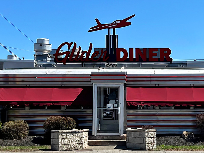 The iconic red glider airplane perched atop this classic Scranton diner isn't just decoration—it's a beacon calling hungry travelers home to comfort food paradise.