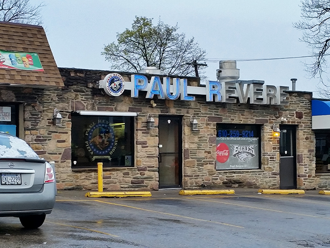 The stone exterior of Paul Revere Pizza House stands like a culinary fortress, its blue sign a beacon for those seeking Pennsylvania's finest pizza cheesesteaks.