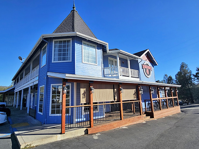 That blue Victorian charm meets serious barbecue business &ndash; where fairy tale architecture houses smoky dreams. 