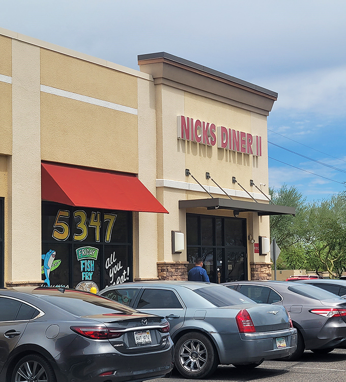 The unassuming storefront of Nick's Diner II stands like a beacon of breakfast hope amid the Arizona sunshine. Classic diner signage promises comfort food treasures within.