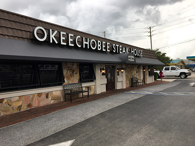 The unassuming exterior of Okeechobee Steak House hides a carnivore's paradise within. Like finding a treasure chest disguised as a mailbox.