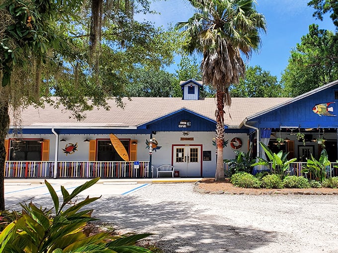 The Blue Crab's cheerful exterior welcomes you like an old friend, with palm trees standing guard and colorful crab decorations hinting at the treasures within.