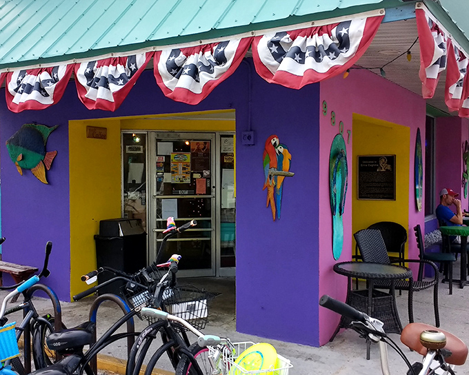 This colorful island paradise practically shouts "come on in!" with its vibrant purple walls and patriotic charm.