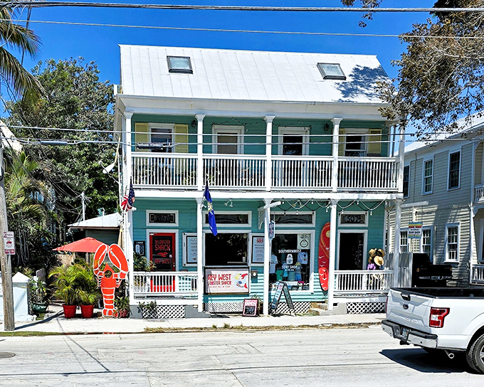 The turquoise beacon of seafood salvation stands proudly on Key West's sun-drenched streets, promising lobster treasures within its classic island architecture.