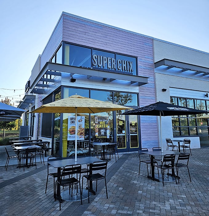 Modern meets mouthwatering at Super Chix's Fort Mill location, where those bright yellow umbrellas practically scream "chicken paradise awaits inside!"